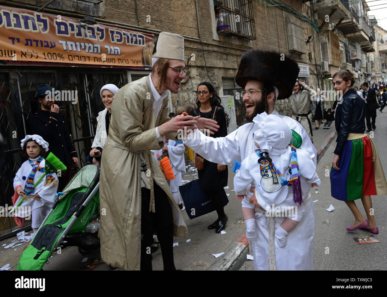 Ultra-Orthodox Jews greet each other on the feast of Purim in Mea ...