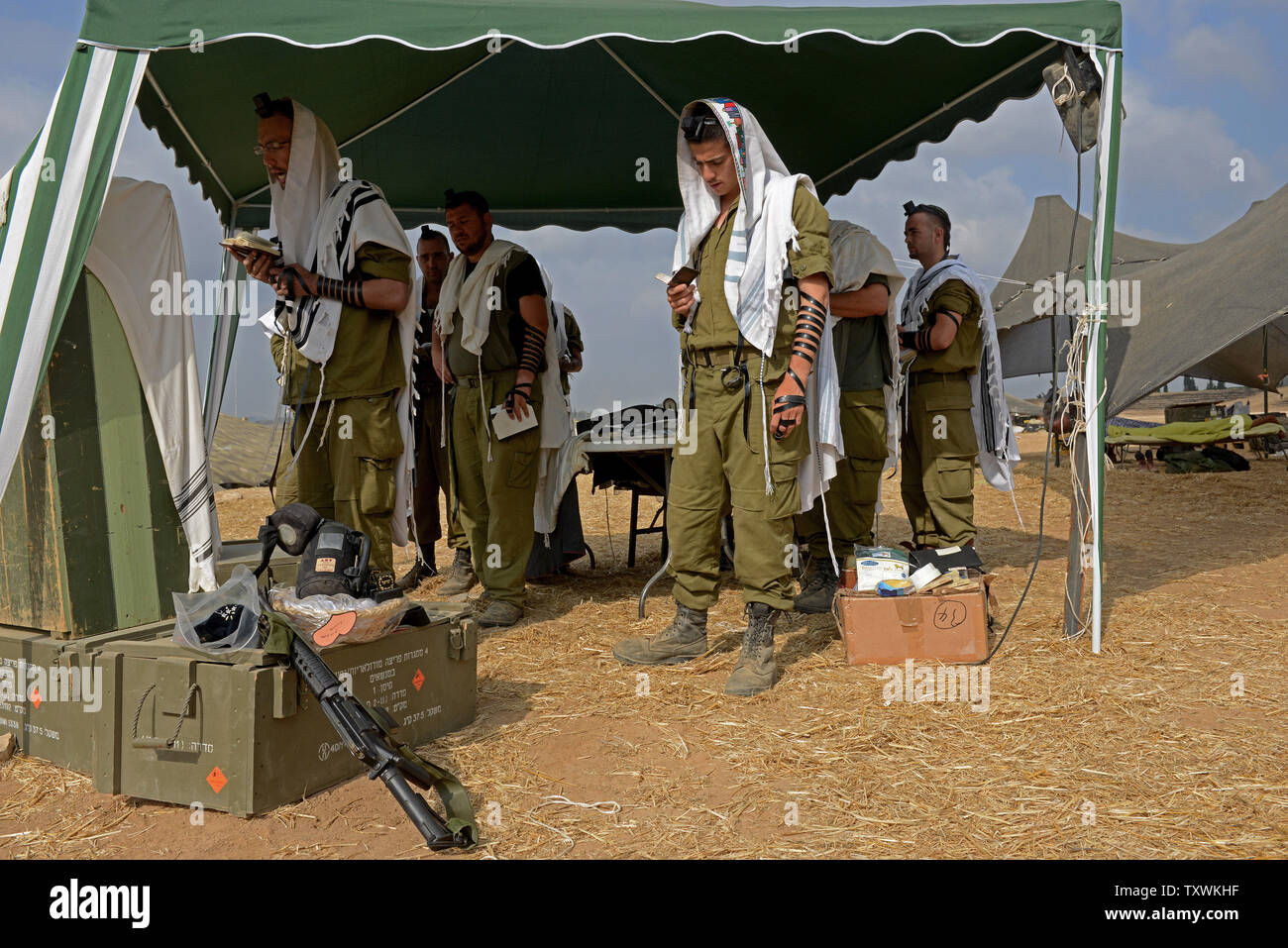Israeli soldiers wear the traditional Jewish prayer shawl during ...