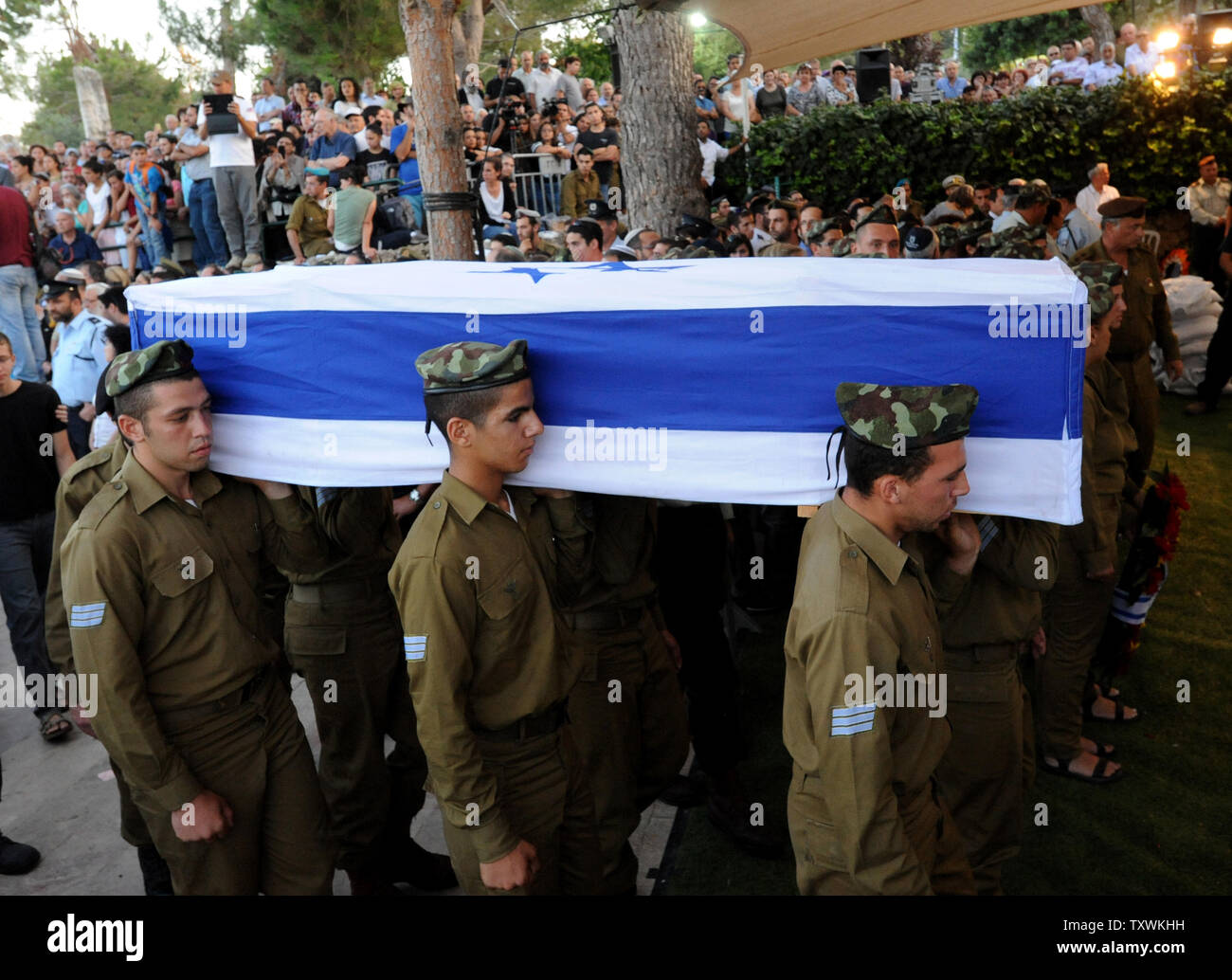 Israeli soldiers carry the flag covered coffin of Staff Sgt. Barkai ...