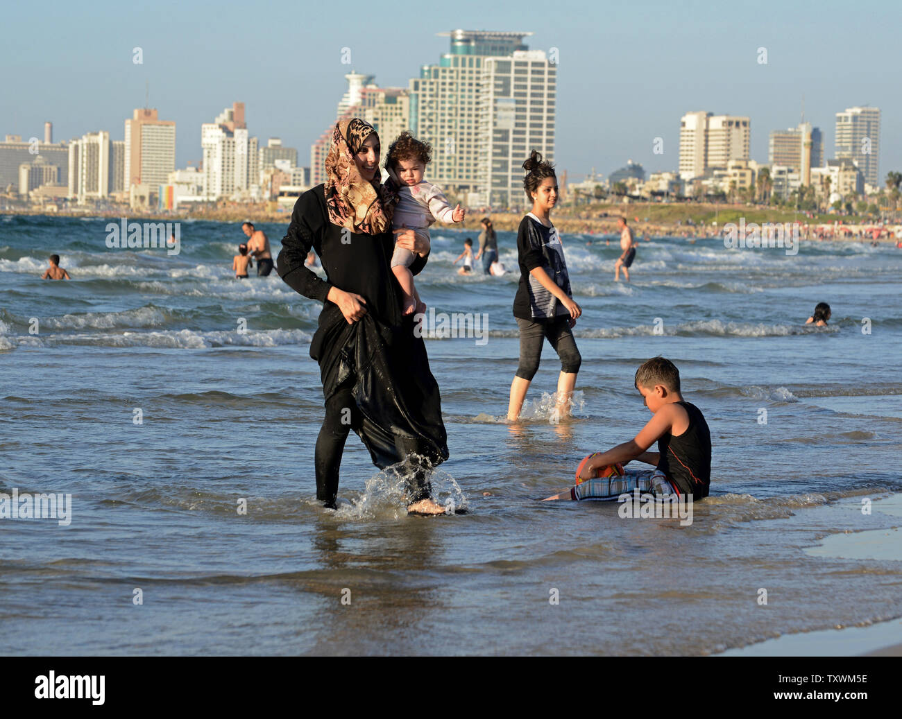 Palestinian Muslims, mostly from the West Bank, enjoy the Mediterranean ...