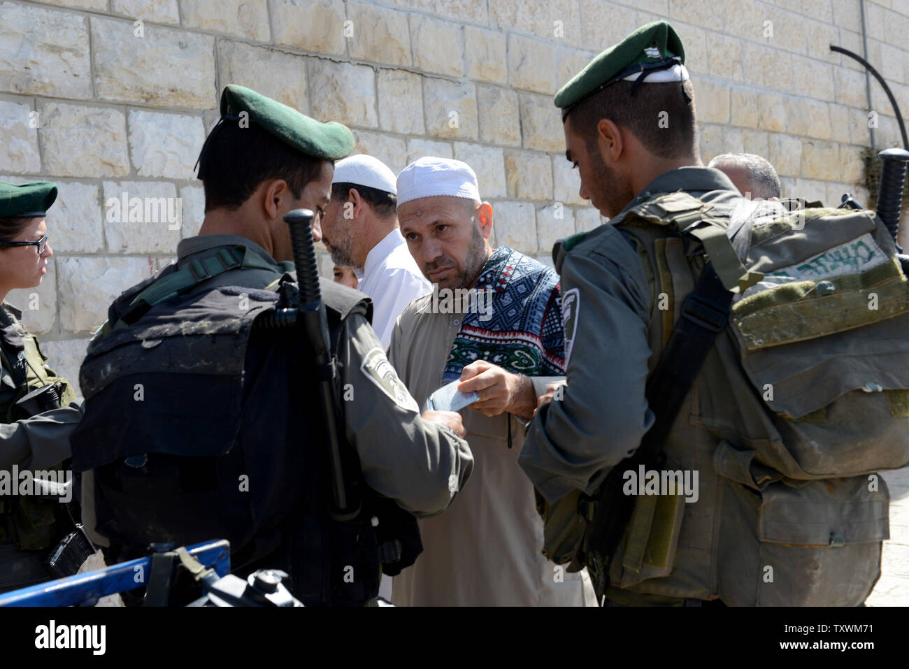 Palestinian border police check identity hi-res stock photography and ...