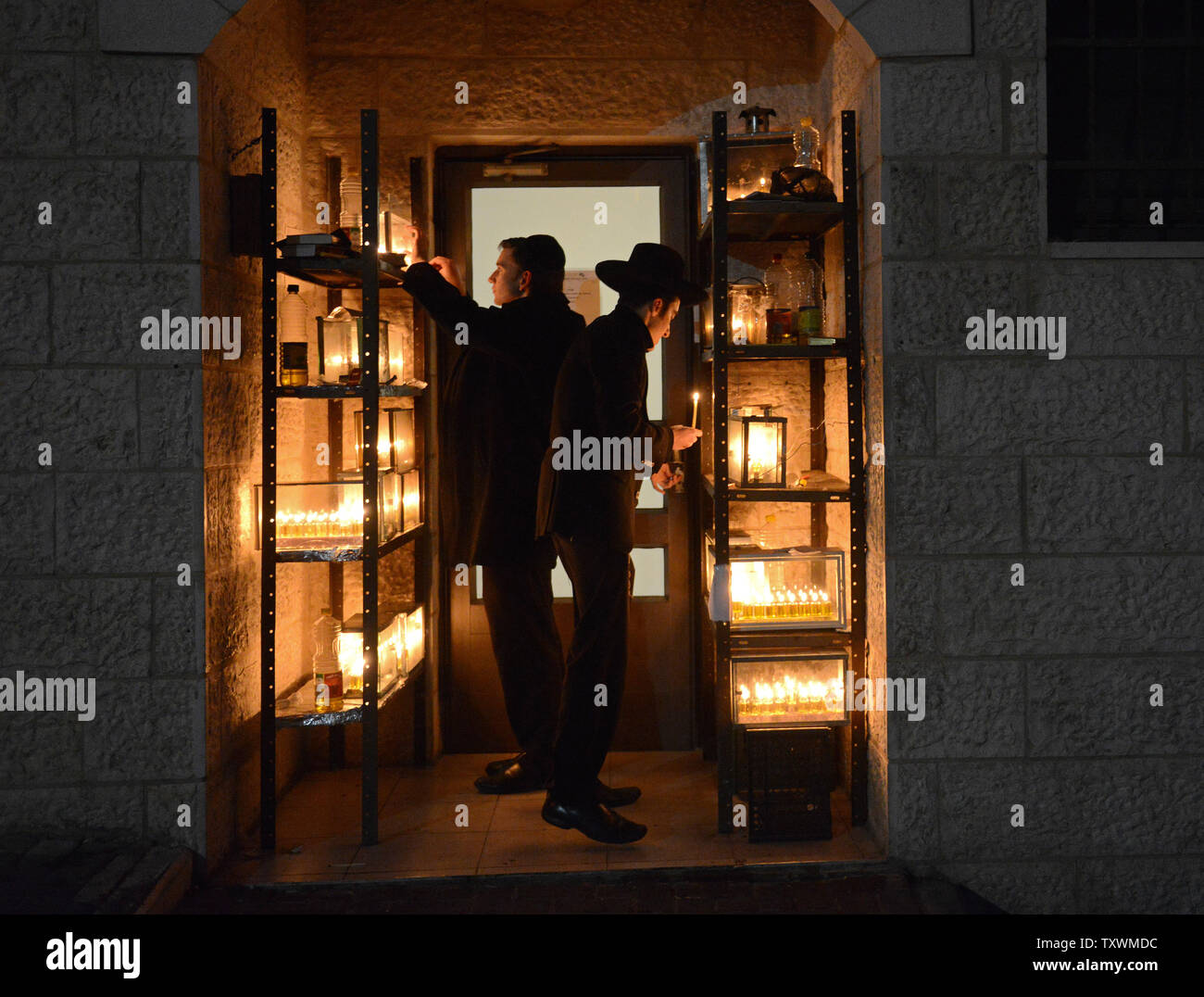 Orthodox Jews light candles on the eighth and final night of the Jewish ...
