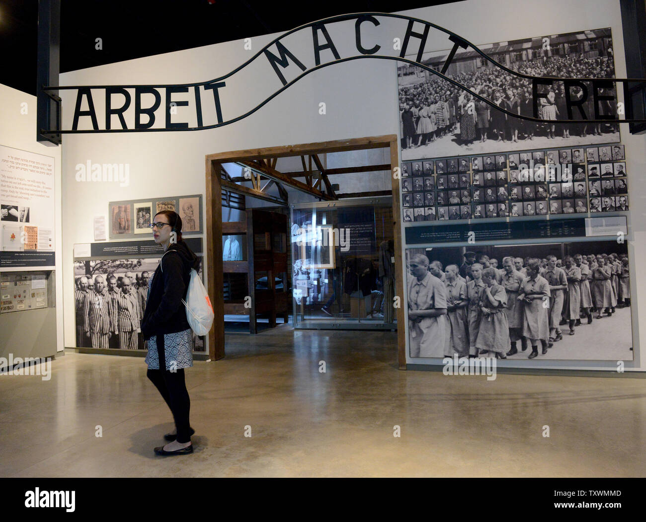 A visitor tours an exhibit showing the rise of Nazi Germany during War ...