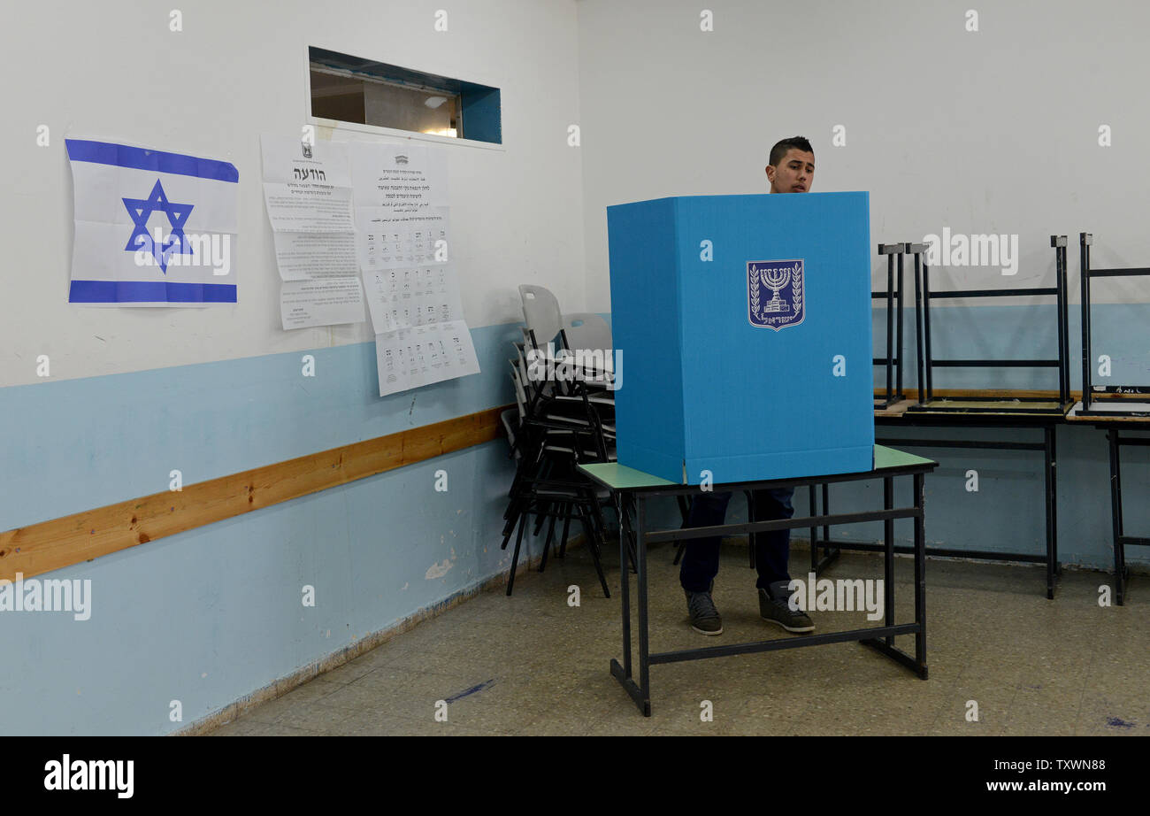 An Arab Israeli votes in a polling station in the Beit Safafa village ...