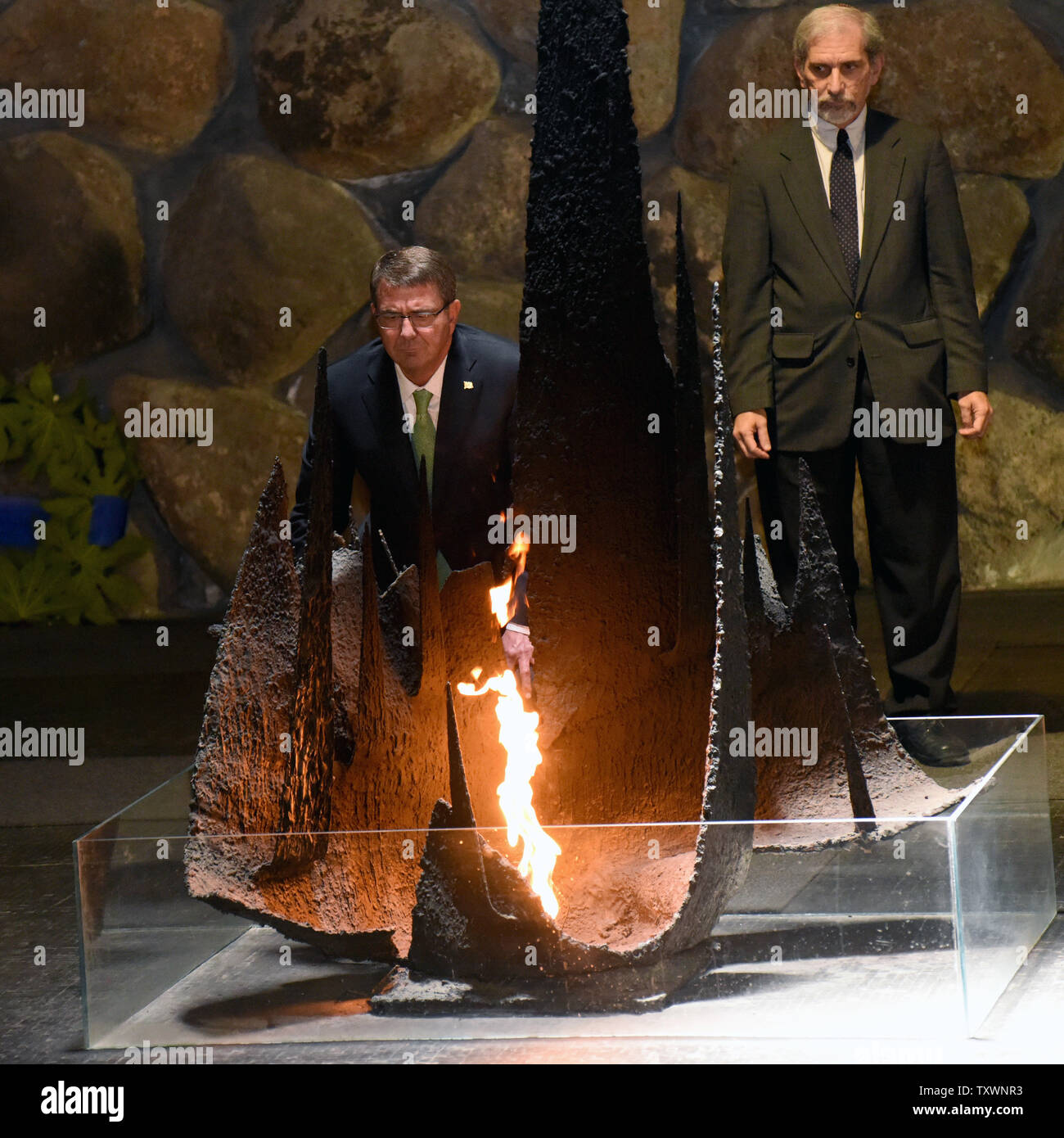 US Secretary of Defense Ashton Carter ignites the eternal flame during ...