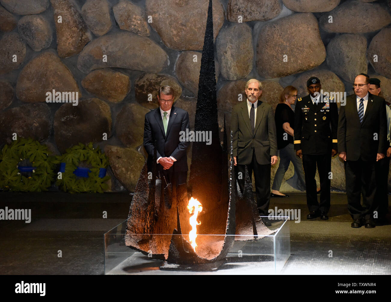 US Secretary of Defense Ashton Carter stands in a moment of silence ...