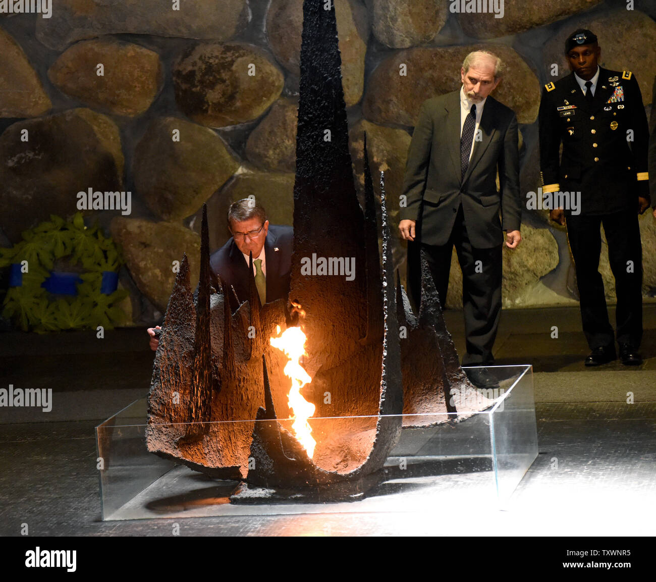 US Secretary of Defense Ashton Carter ignites the eternal flame during ...