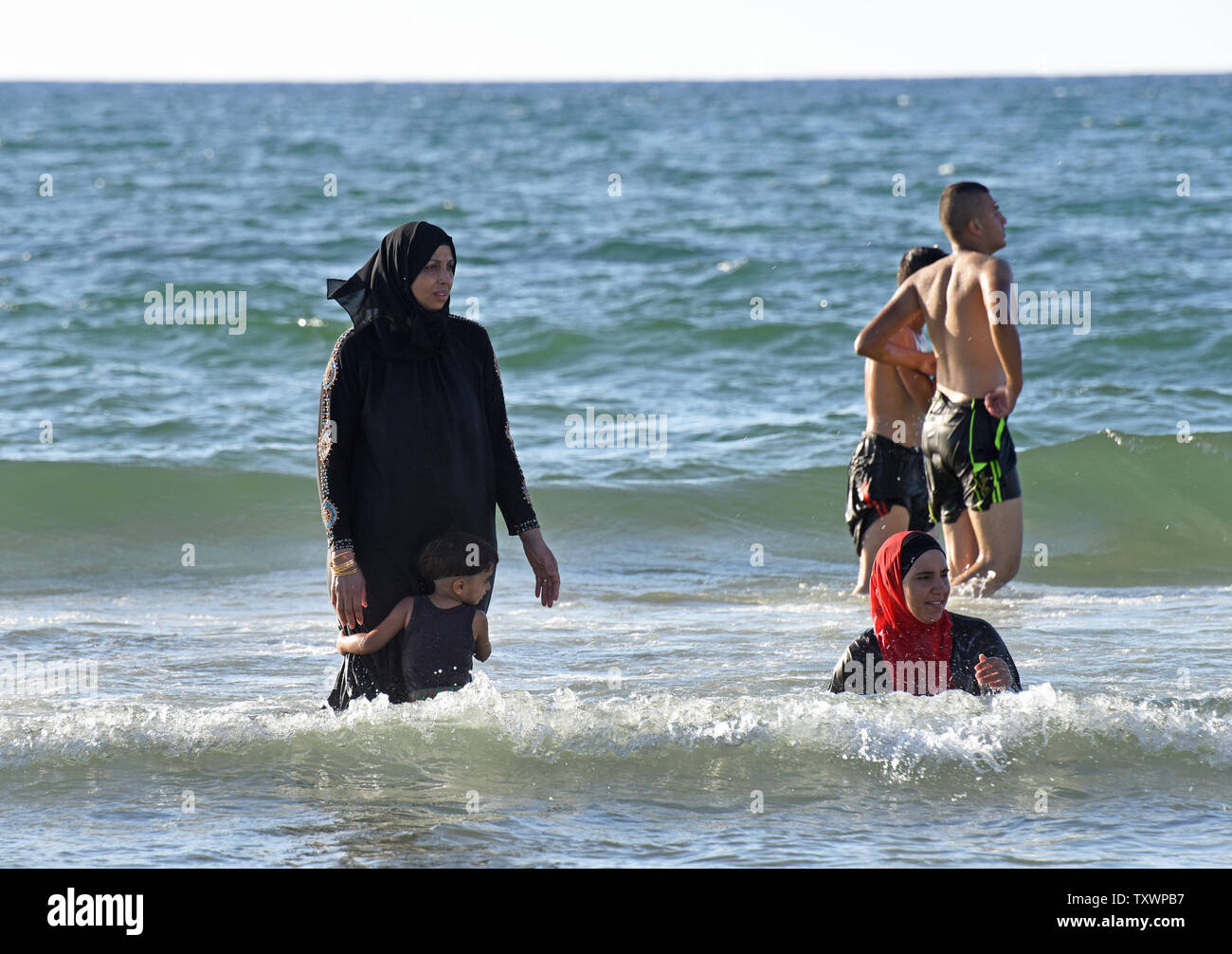 Muslim Palestinians swim in the Mediterranean Sea in Tel Aviv, Israel ...