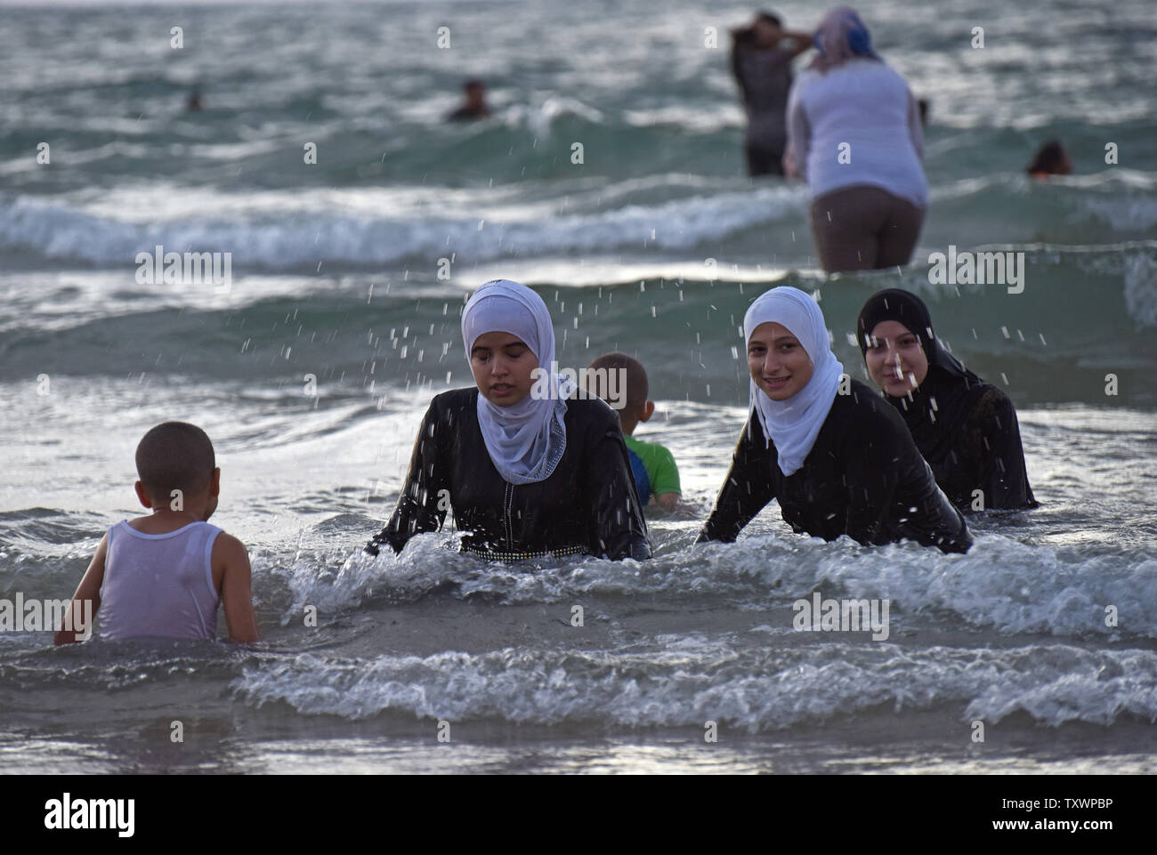 Muslim Palestinians swim in the Mediterranean Sea in Tel Aviv, Israel ...