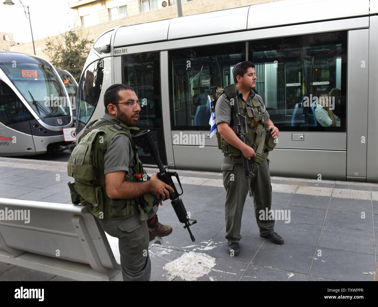 Israeli border police patrol near a light rail train station in central ...
