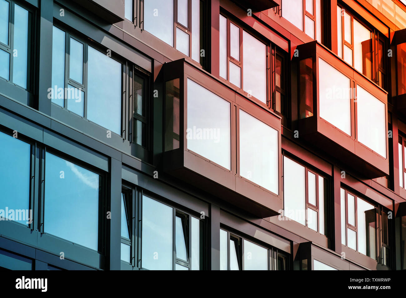building facade , sunset reflection on windows - real estate concept ...