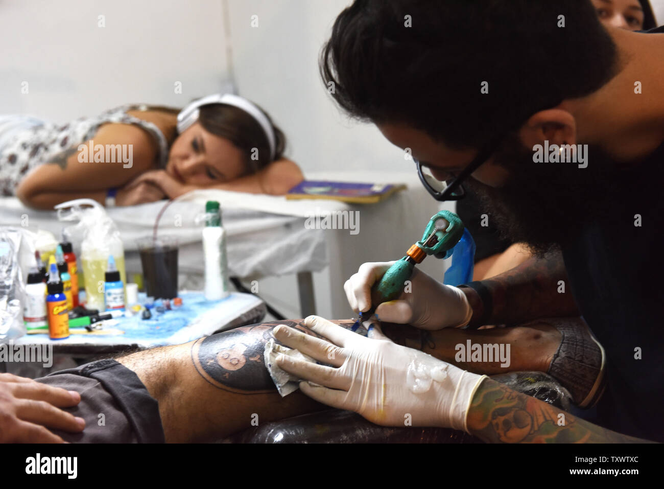 An Israeli gets a tattoo at the Israeli Tattoo Convention in Tel Aviv ...