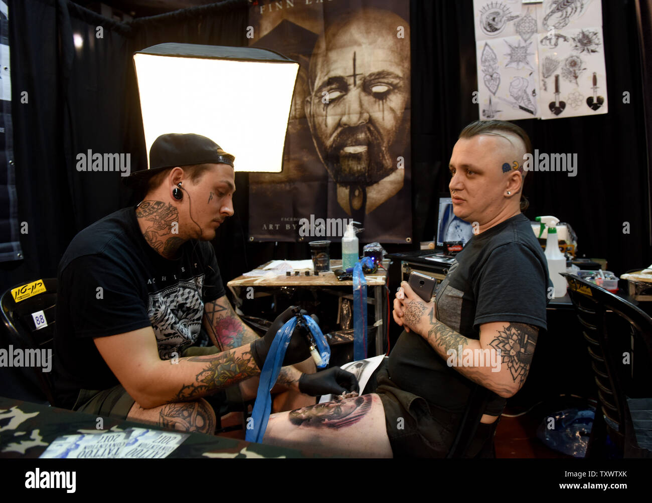 An Israeli gets a tattoo at the Israeli Tattoo Convention in Tel Aviv ...