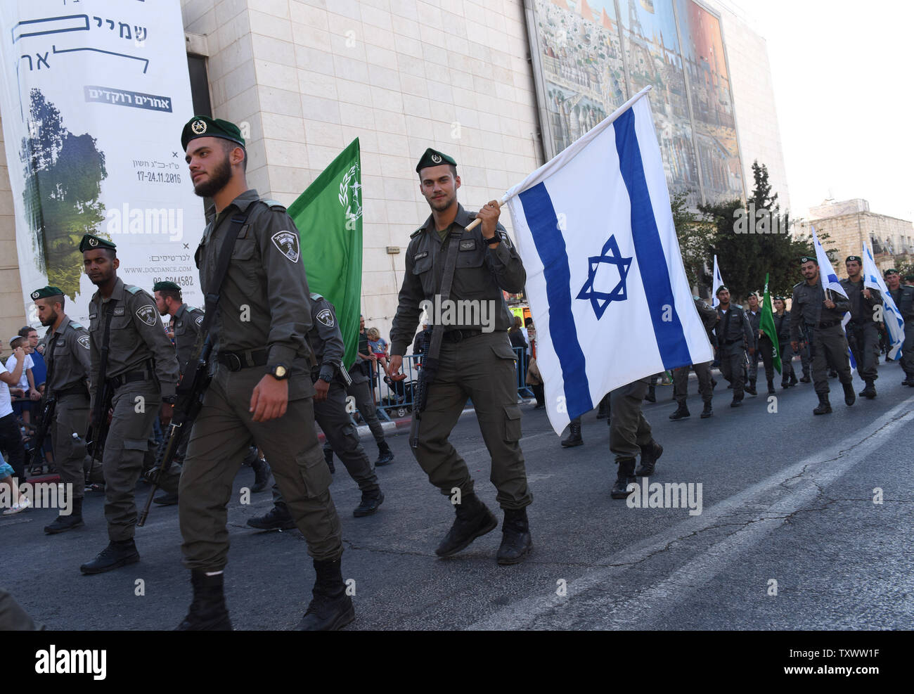 An Israeli border police carries an Israeli flag during the annual ...