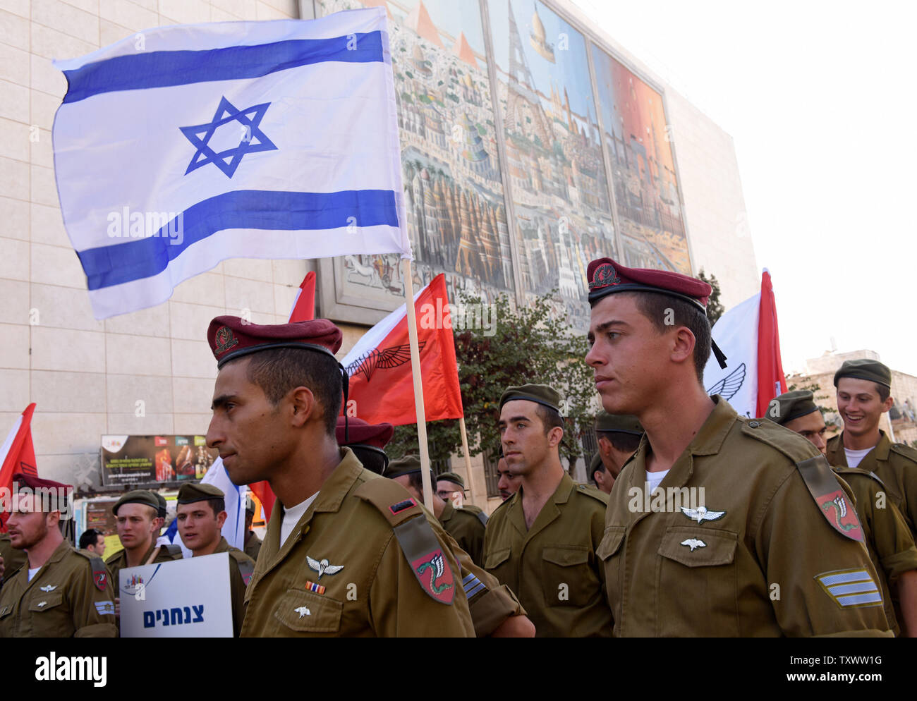 Israeli soldiers carry an Israeli flag during the annual Jerusalem ...