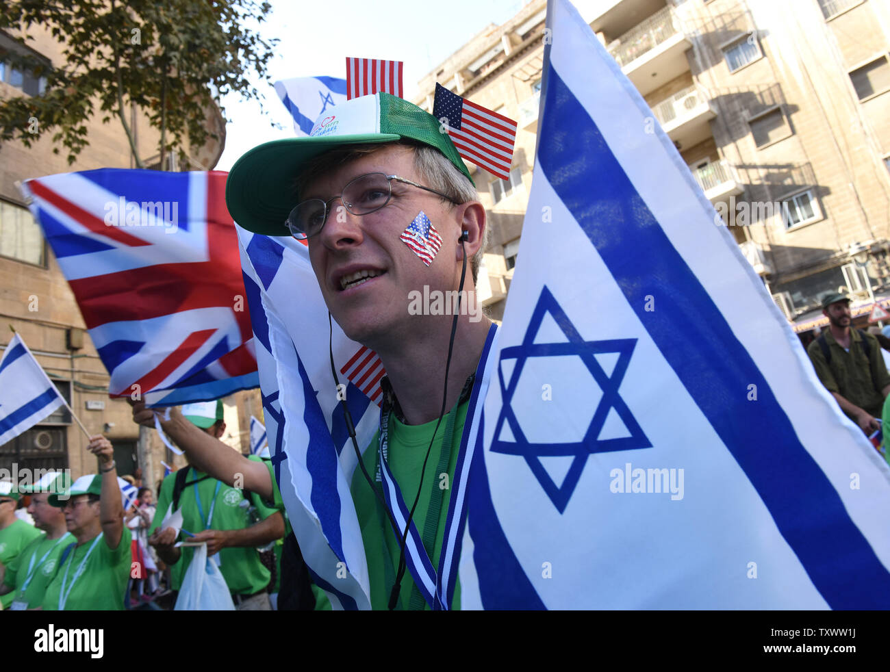 An evangelical Christian from America carries an Israeli flag during ...