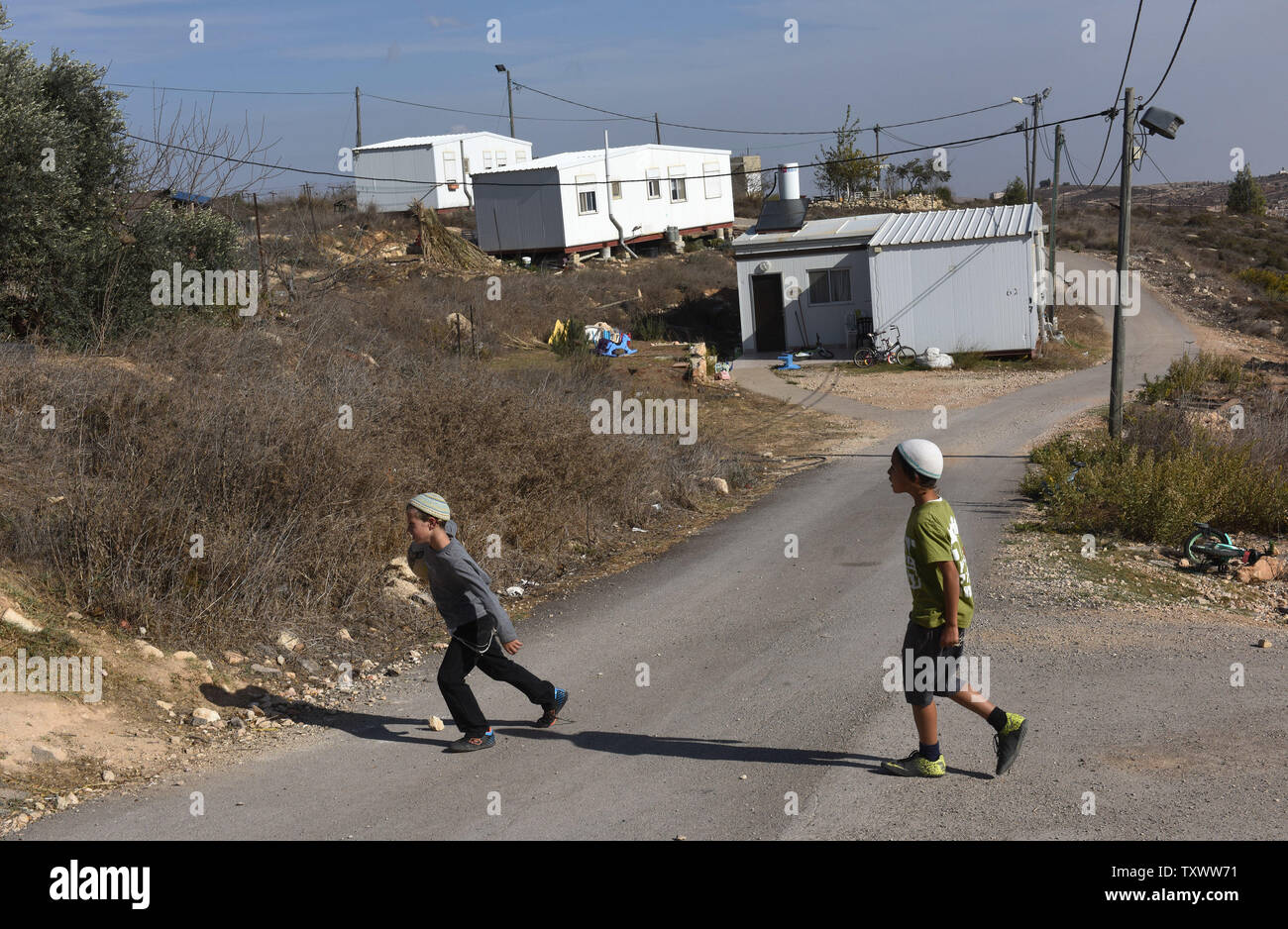 Jewish children play the unauthorized Israeli settlement outpost Amona ...