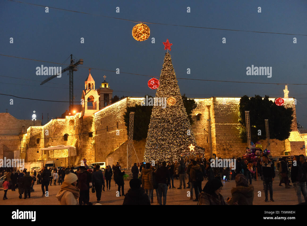 Visitors walk outside the Church of Nativity, where tradition believes ...