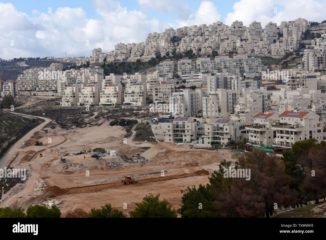 Heavy equipment clears land for new Jewish housing in the Israeli ...