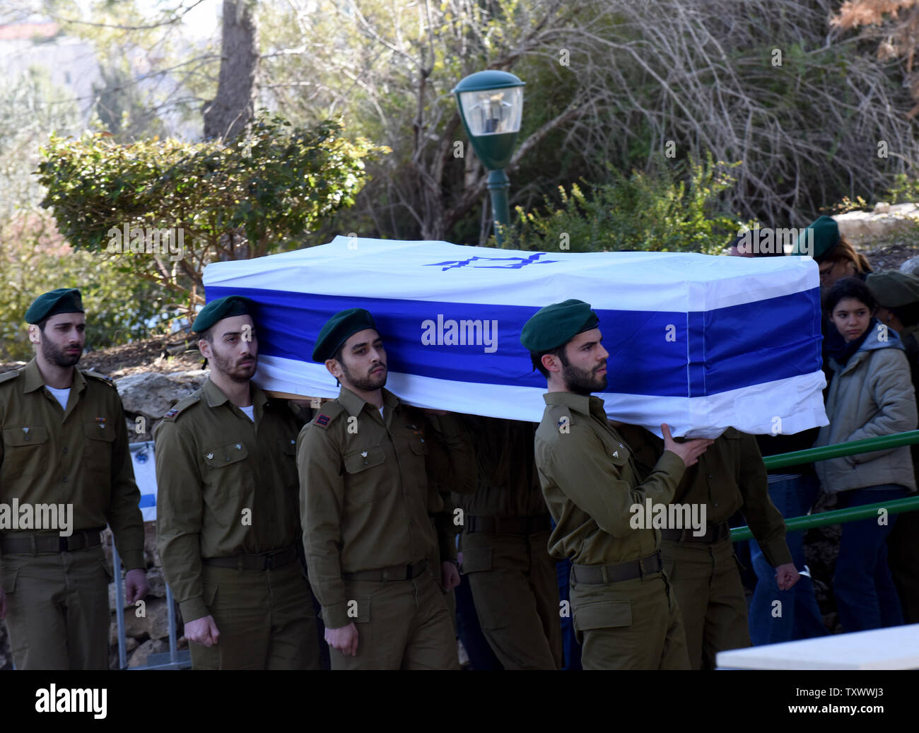 Israeli soldiers carry the flag covered coffin of Lt. Shir Hajaj, 22 ...