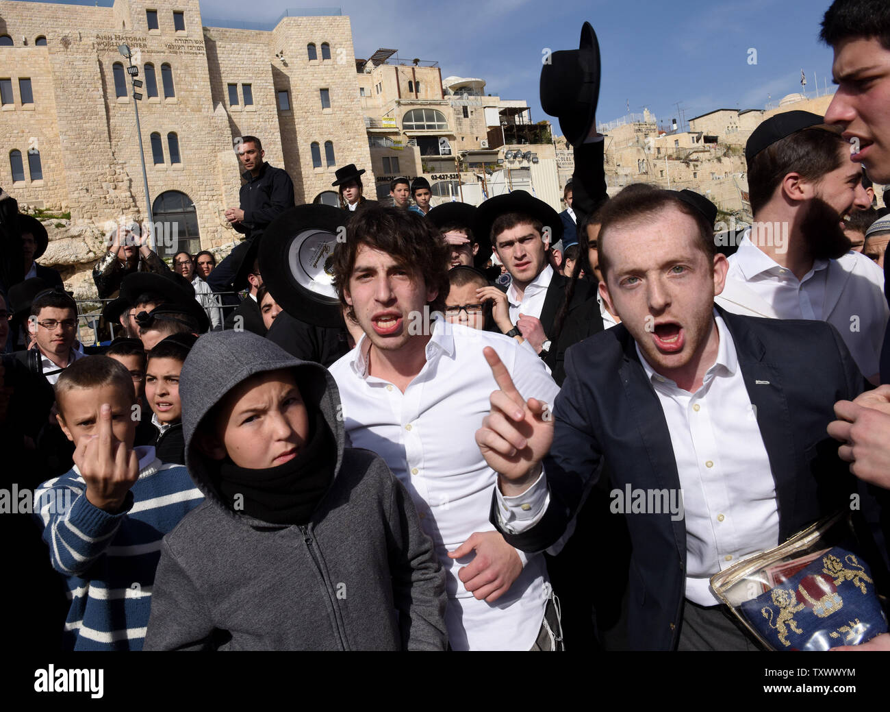 Ultra-Orthodox Jews shout at liberal Jewish women, not seen, from the ...