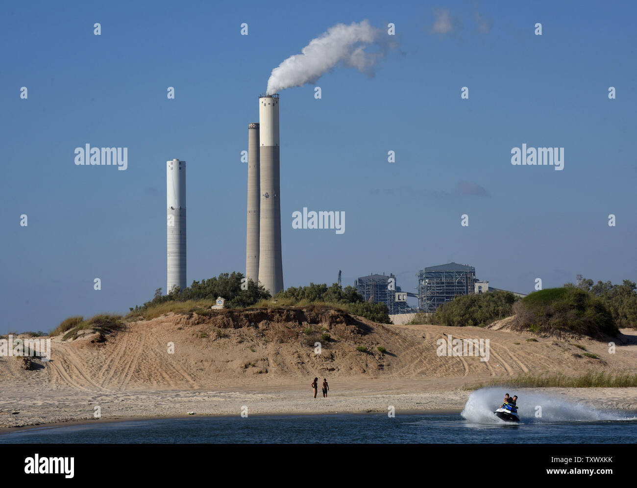 Israel's electric power plant is seen in the distance in Ashkelon, as ...