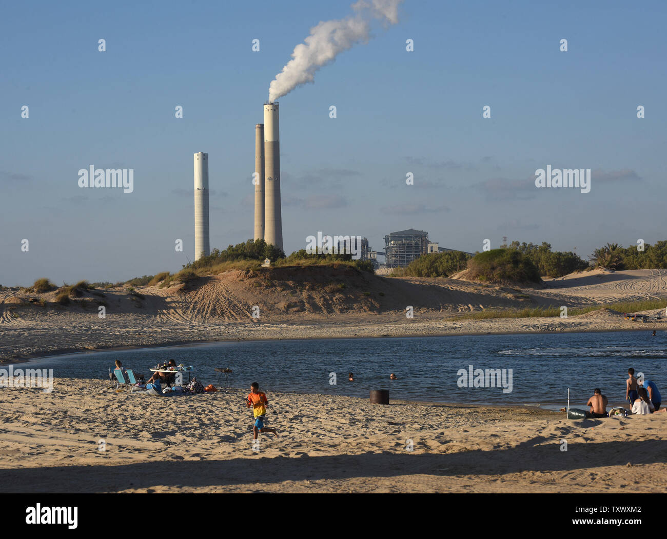 Israel's electric power plant is seen in the distance in Ashkelon, as ...