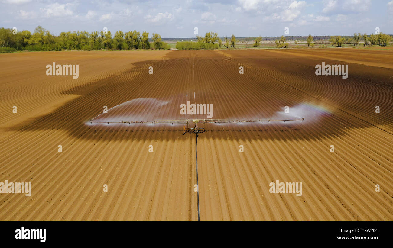 aerial view Center pivot agriculture irrigation machine of crops. An ...