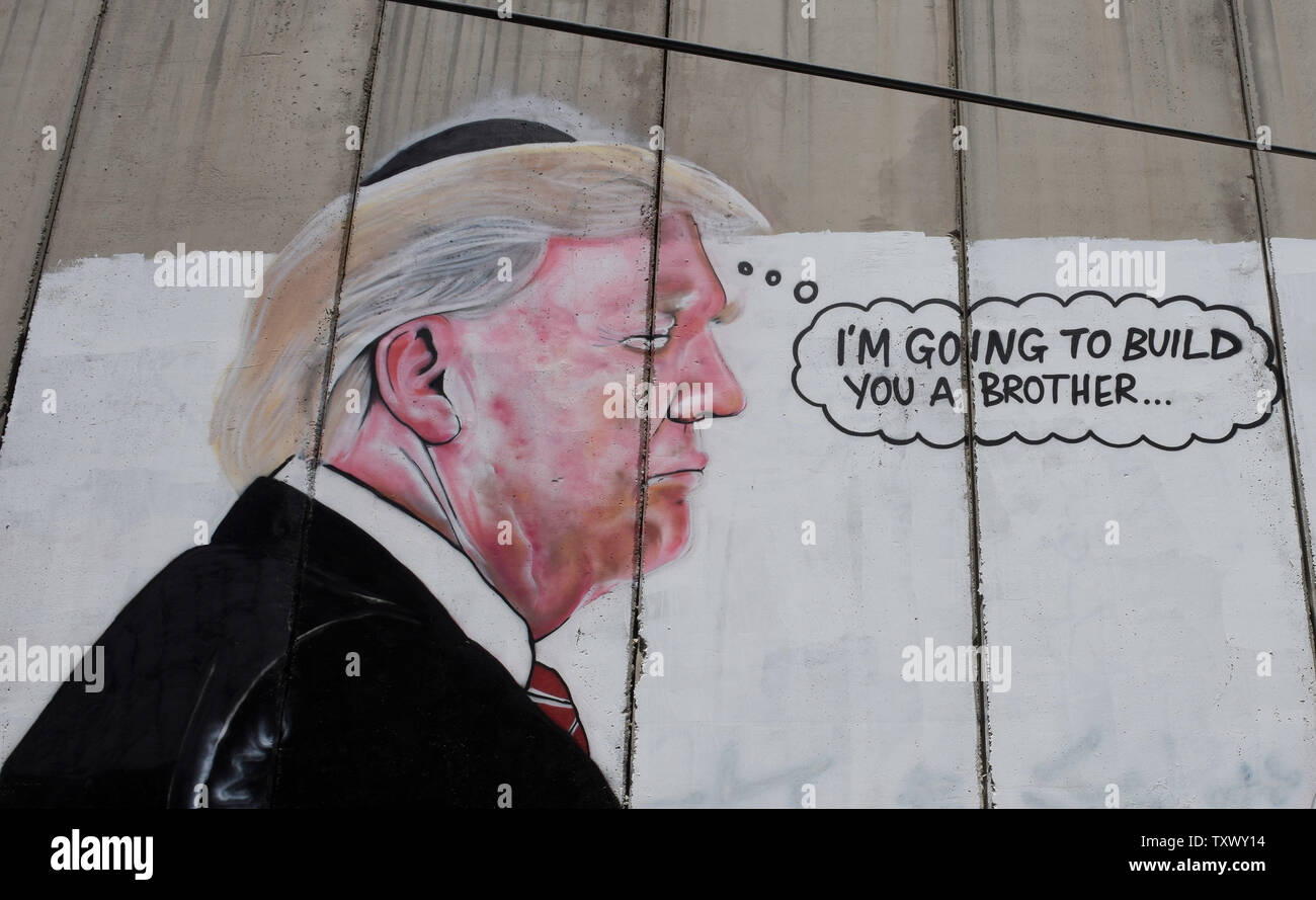 Graffiti of U.S. President Donald Trump is seen on Israel's ...