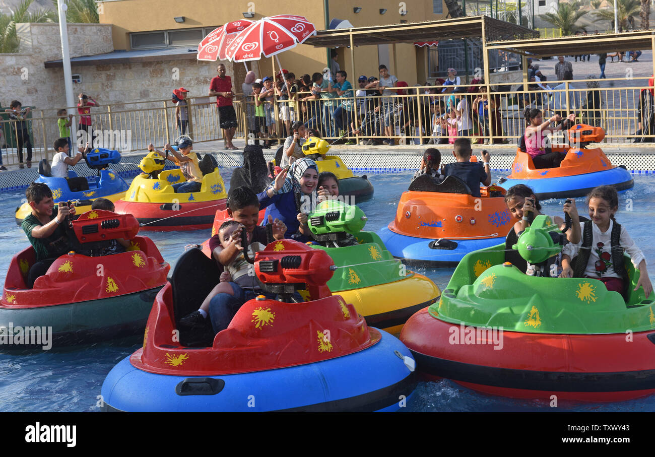 Palestinians celebrate the third day of the Muslim feast of Eid al-Adha ...