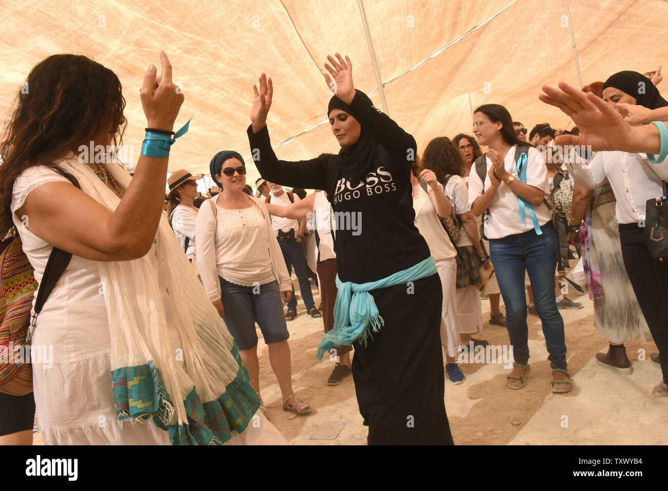 Israeli and Palestinian women dance before the Women Wage Peace March ...