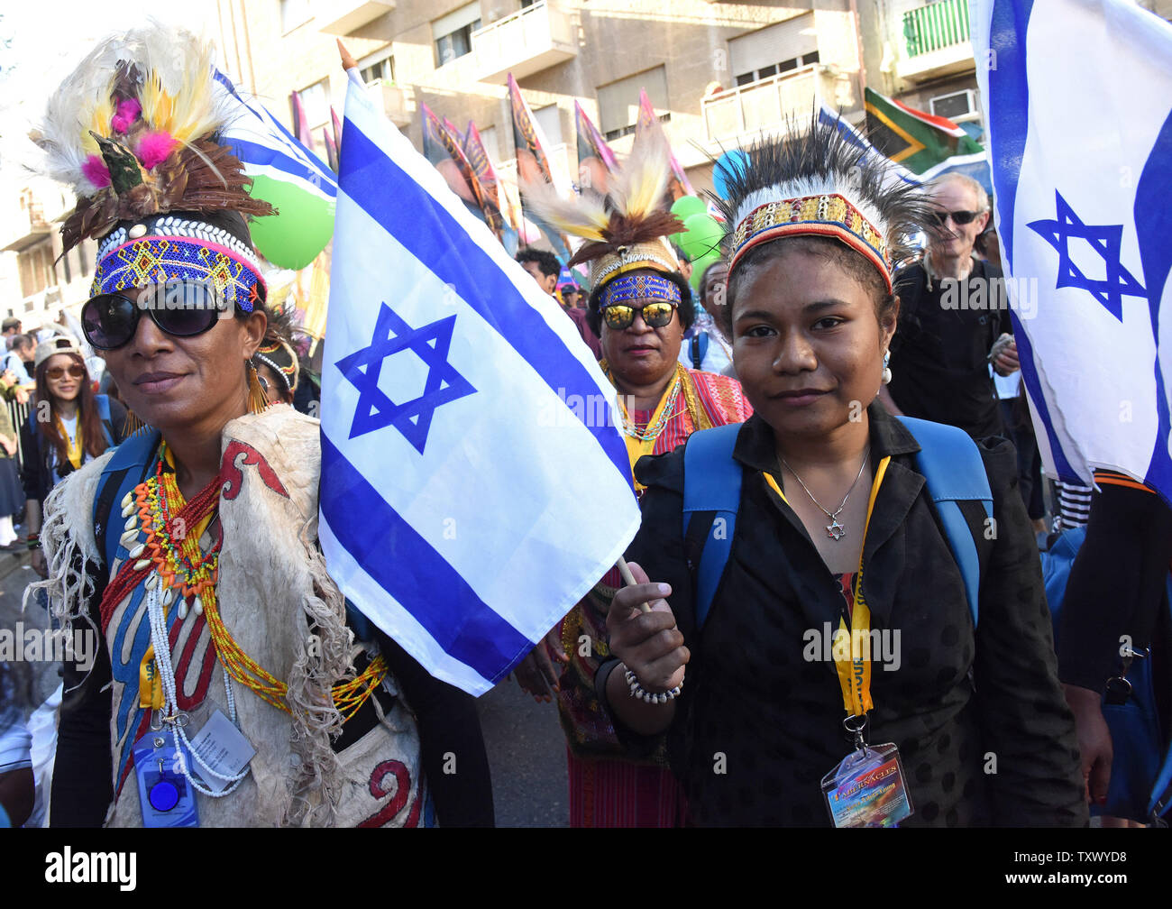 Pro-Israel Christians wear colorful costumes and carry Israeli flags in ...