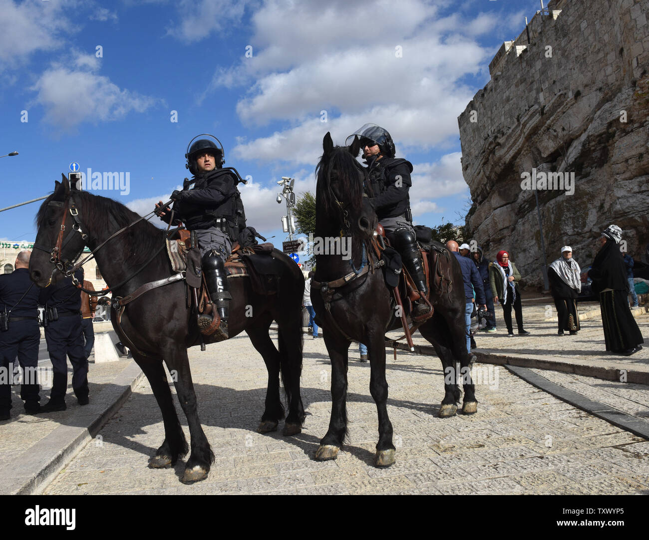 Israeli mounted police patrol outside Jerusalem's Old City during a ...