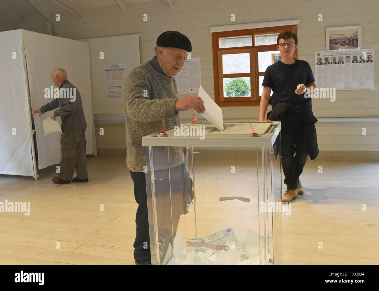 A Russian citizen cast his ballot for the Russian presidential election ...