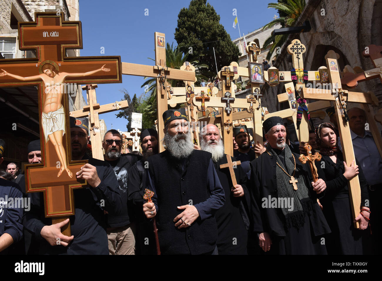 Orthodox Christians from Serbia carry large wooden crosses during the ...