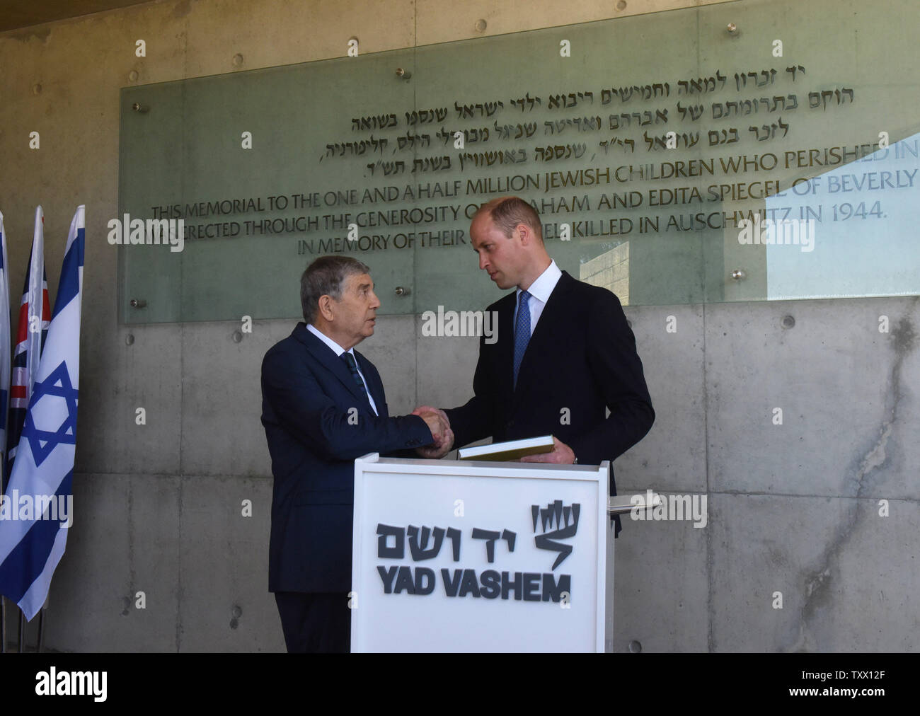 Prince William, the Duke of Cambridge, shake hands with the Chairman of ...