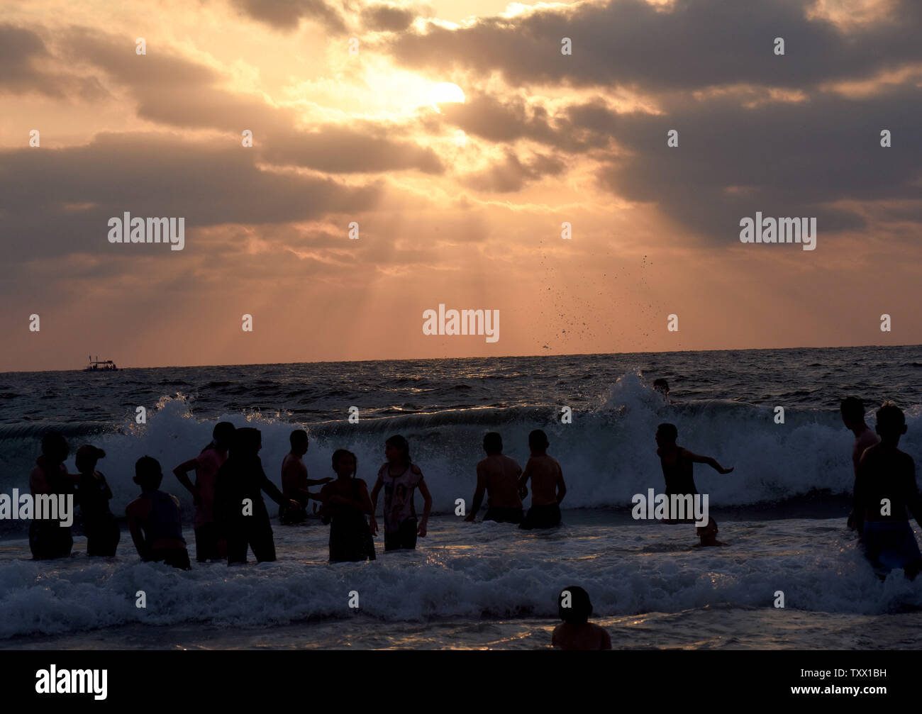 Palestinians enjoy the Mediterranean Sea on a beach in Tel Aviv, Israel ...