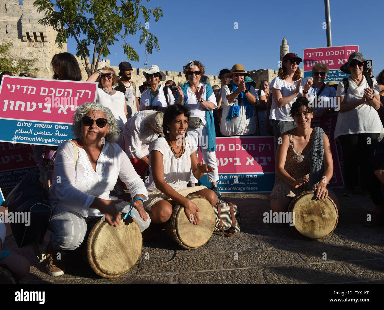 Israeli and Arab women with the peace group 'Women Wage Peace' hold a ...