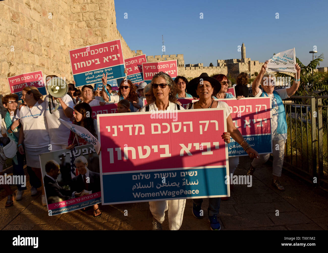 Israeli and Arab women with the peace group 'Women Wage Peace' holds ...