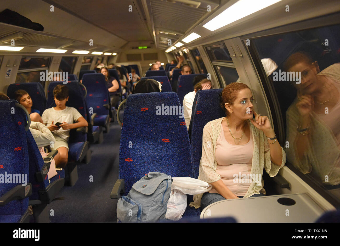 Israelis ride the Jerusalem fast train from the new Yitzhak Navon train ...