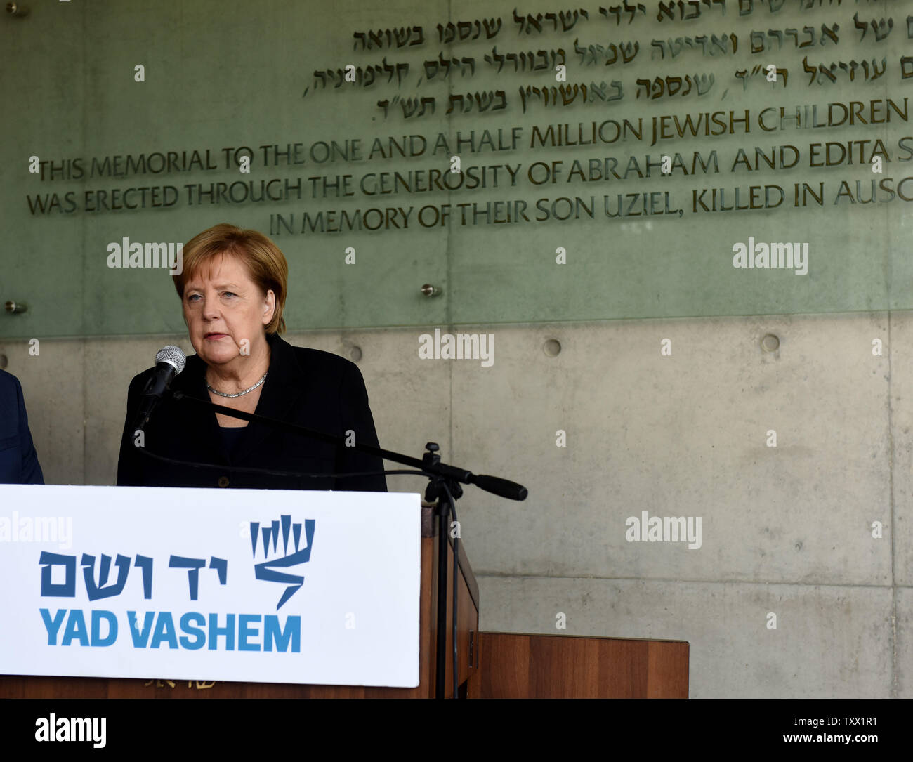 German Chancellor Angela Merkel speaks after signing the guest book of ...