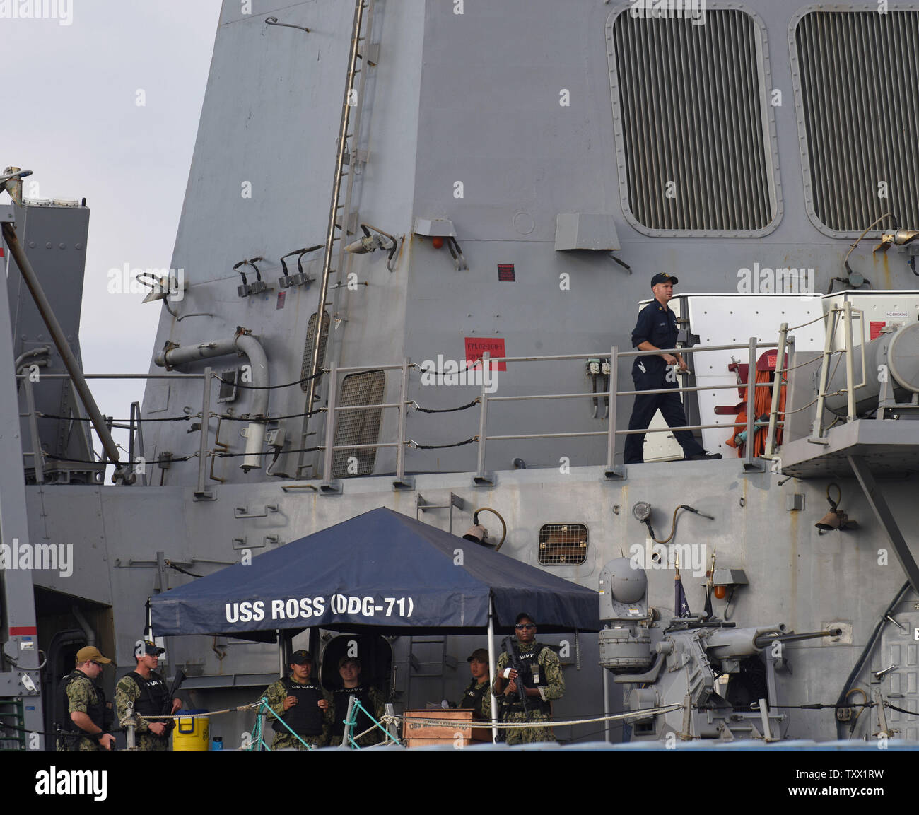 American soldiers stand on the deck of the destroyer, the USS Ross of ...