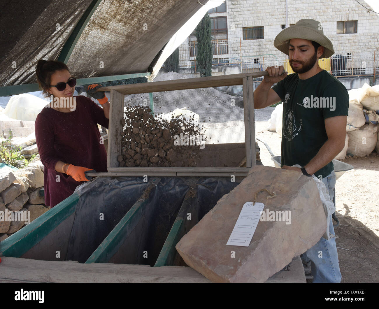 Workers sift dirt at The Ancient Jerusalem Sifting Project, where a ...
