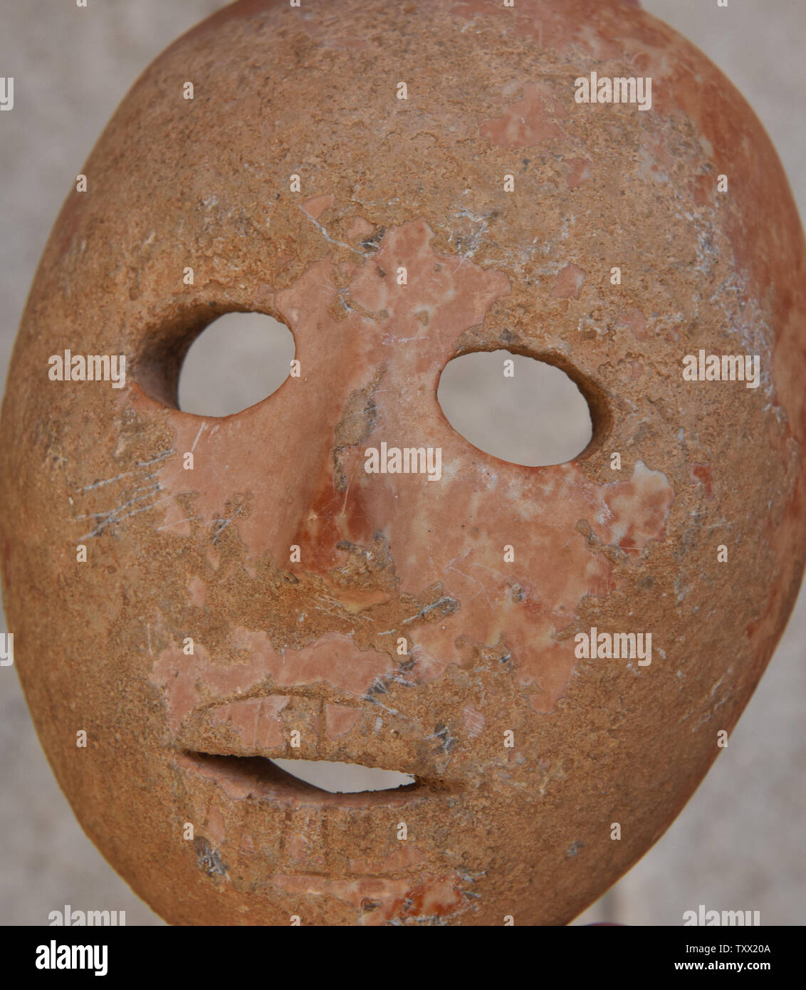A close-up of a rare 9,000 year old stone mask that was uncovered in ...