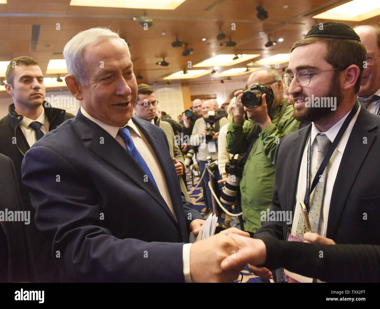Israeli Prime Minister Benjamin Netanyahu greets people after speaking ...
