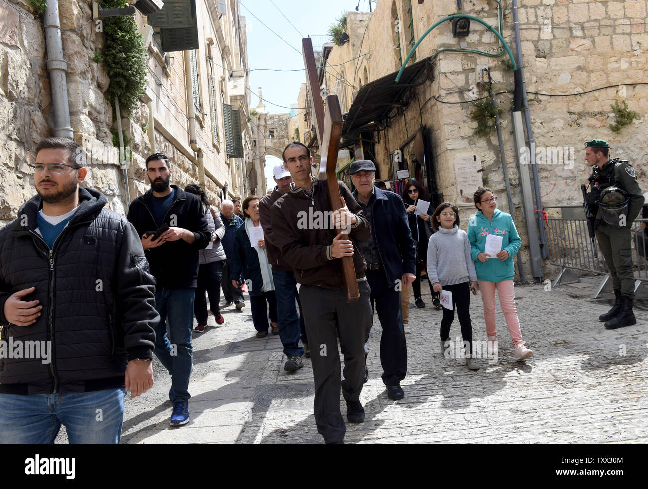 Palestinian Christians carry a cross on the Via Dolorosa, the Way of ...