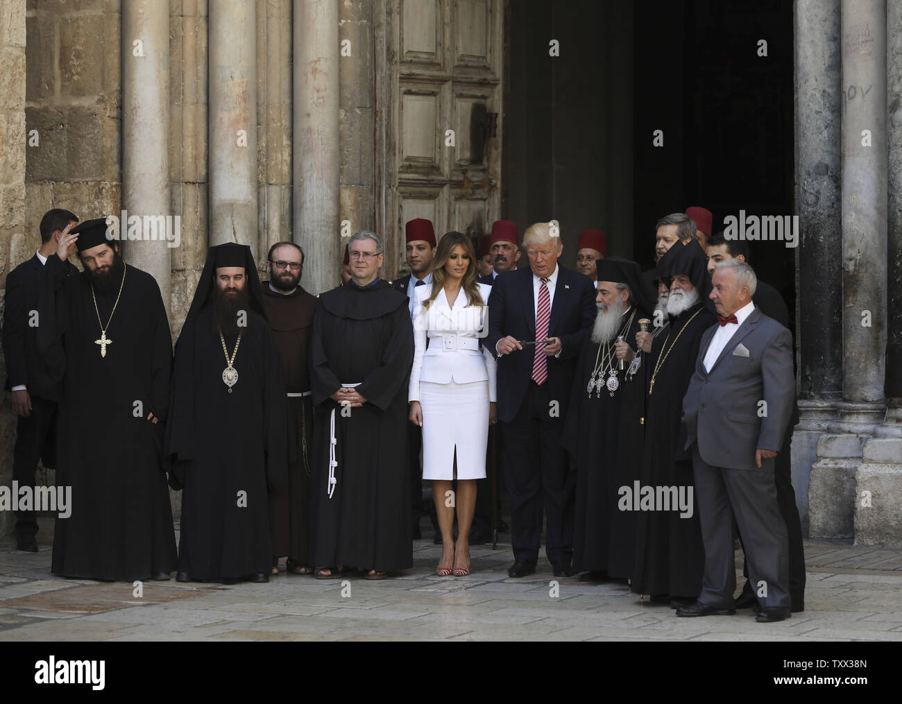 U.S. President Donald Trump (C) and first lady Melania stand at the ...