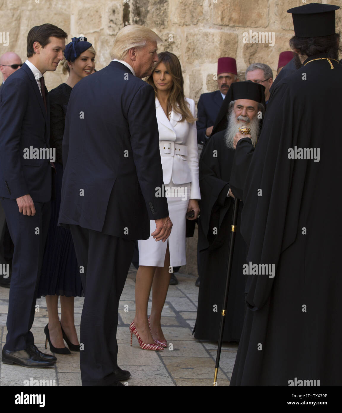 US President Donald Trump and First Lady Melania Trump are greeted by ...
