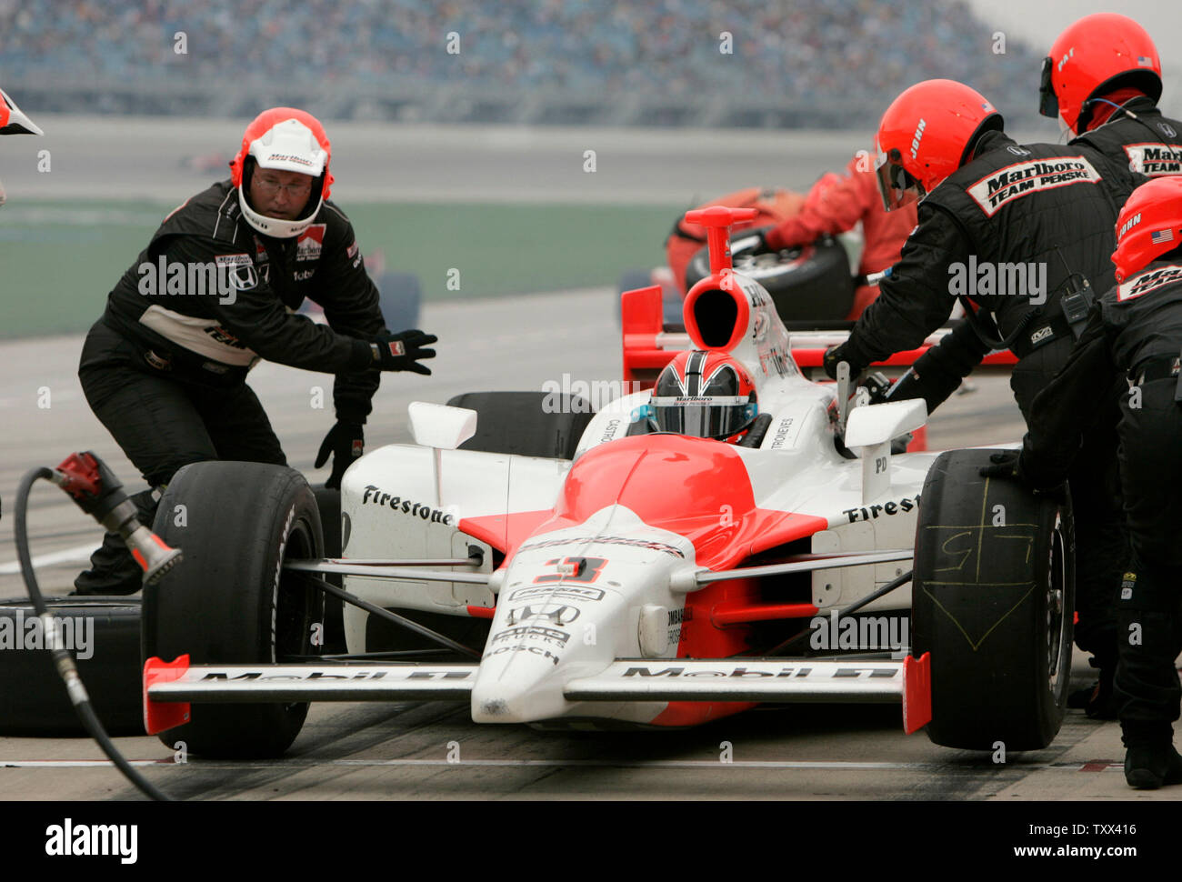 Helio Castroneves (3) pits during the Peak Antifreeze Indy 300 held at ...