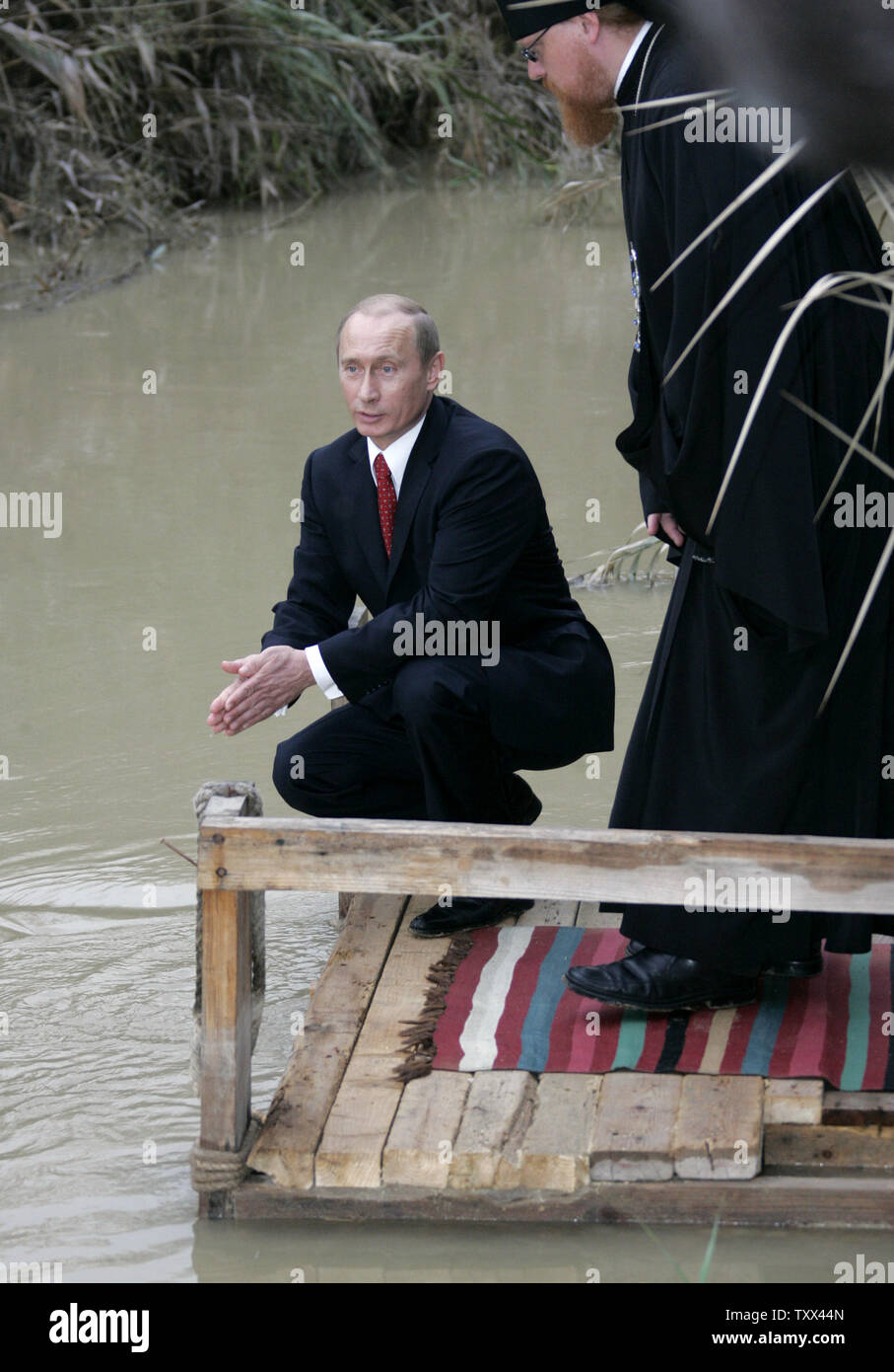 Russian president vladimir putin listens hi-res stock photography and ...